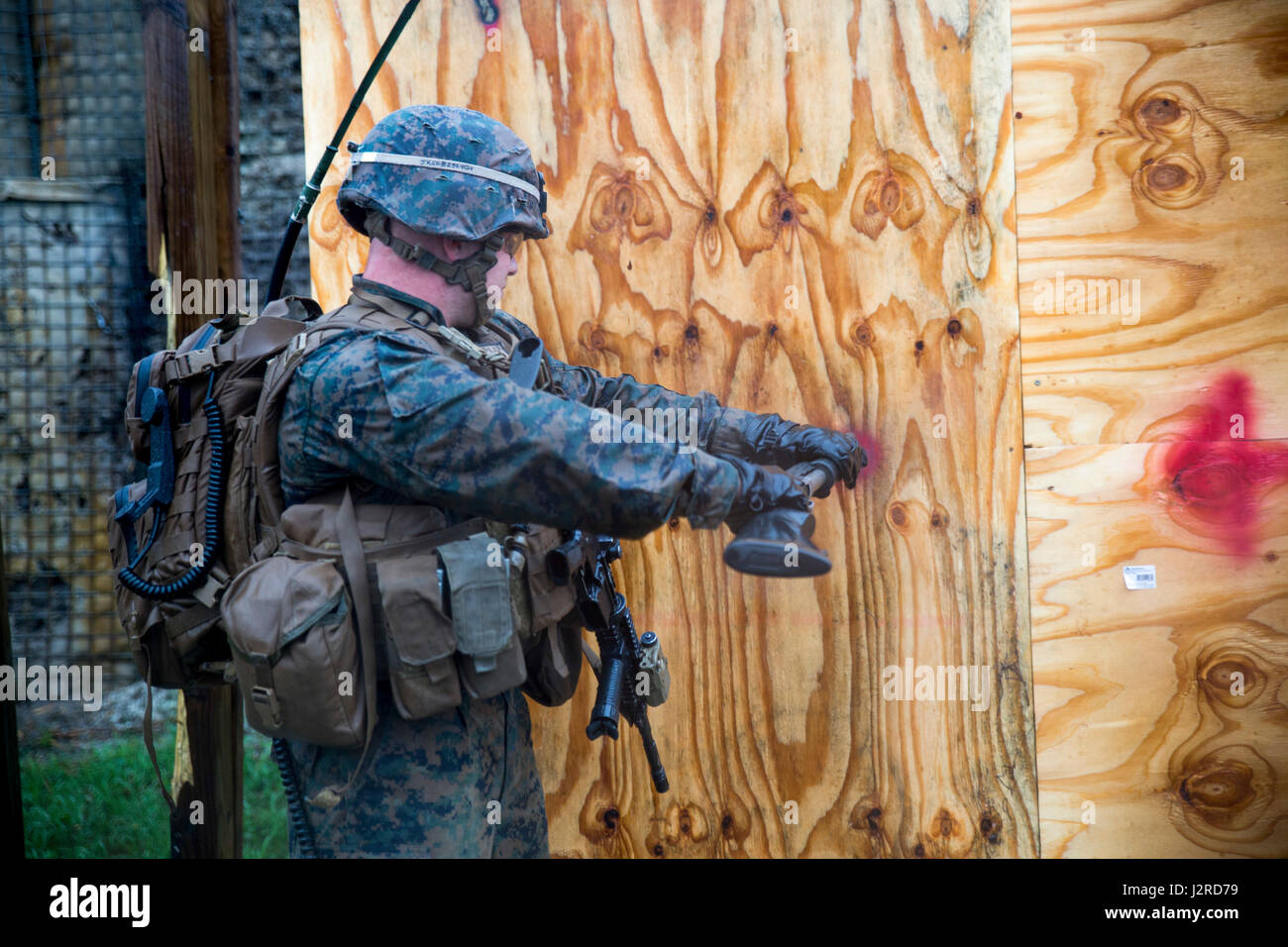 A Marine uses an M500 shotgun for ballistic entry during an urban ...
