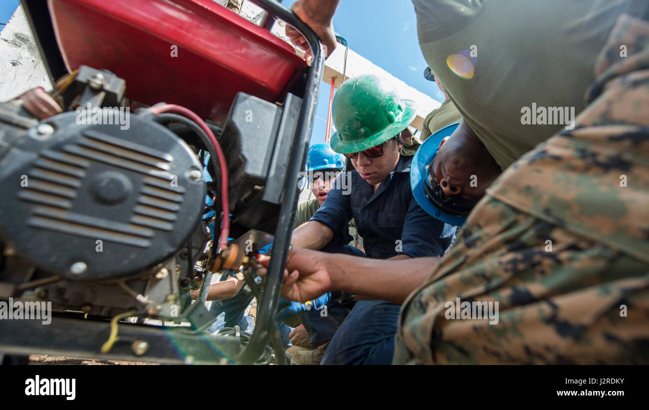 Marines from 9th Engineer Support Battalion repair a diesel welder ...