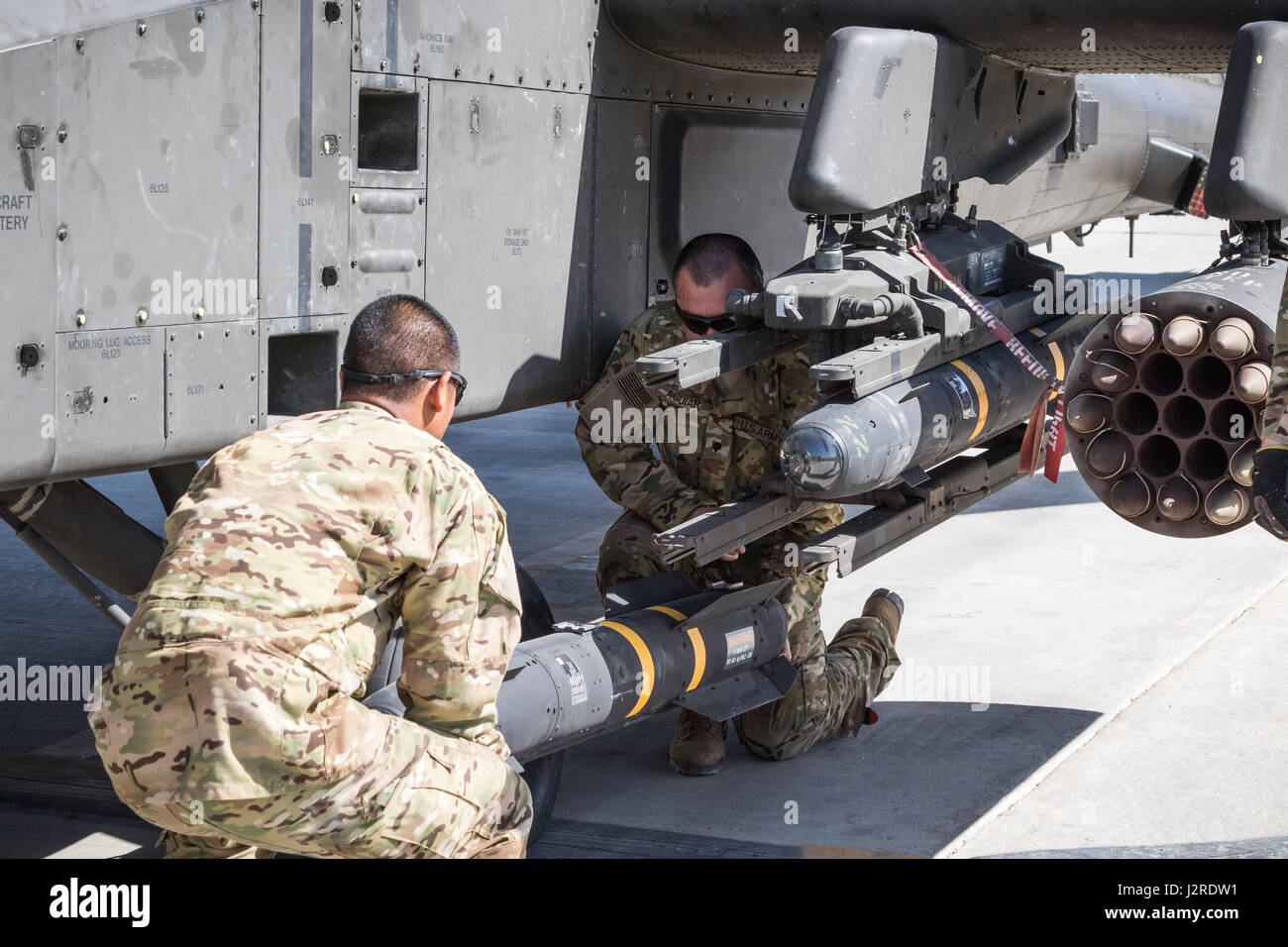 U.S. Army AH-64E Apache helicopter ground crew members assigned to Task ...