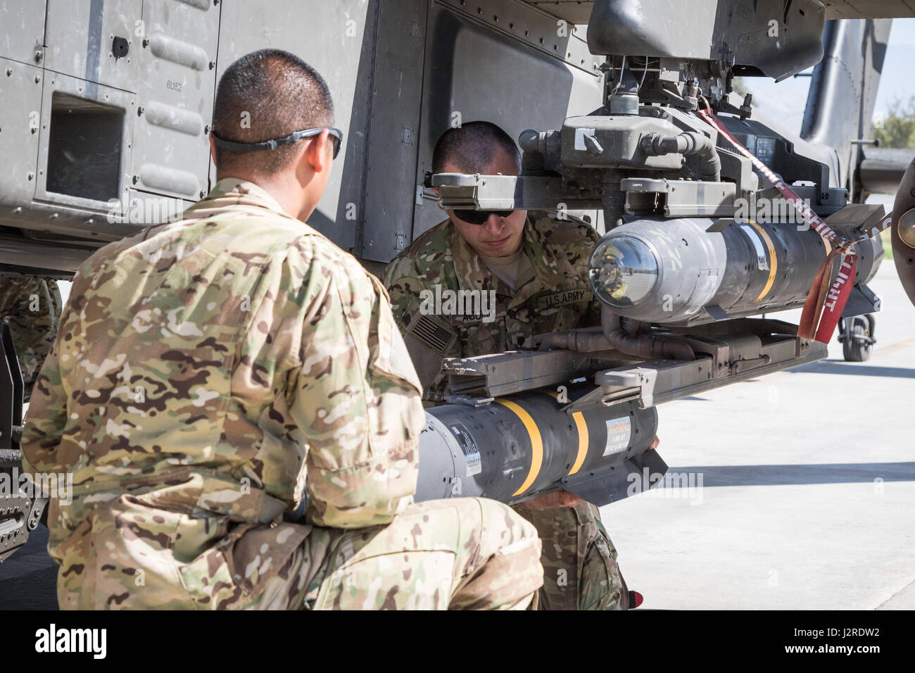 U.S. Army AH-64E Apache helicopter ground crew members assigned to Task ...