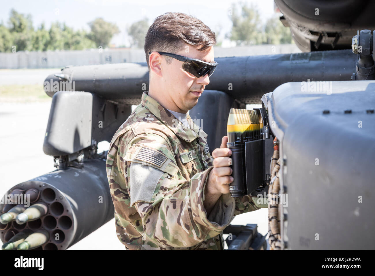 A U.S. Army AH-64E Apache helicopter ground crew member assigned to ...