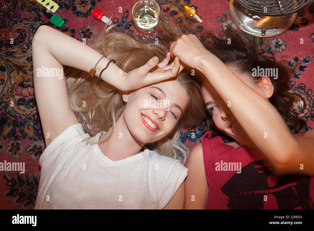 Portrait of two playful young women Stock Photo - Alamy