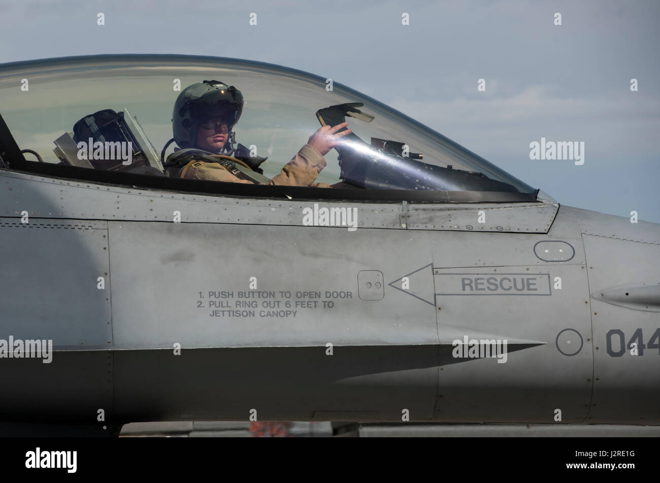 A pilot from the 555th Expeditionary Fighter Squadron throws up the ...