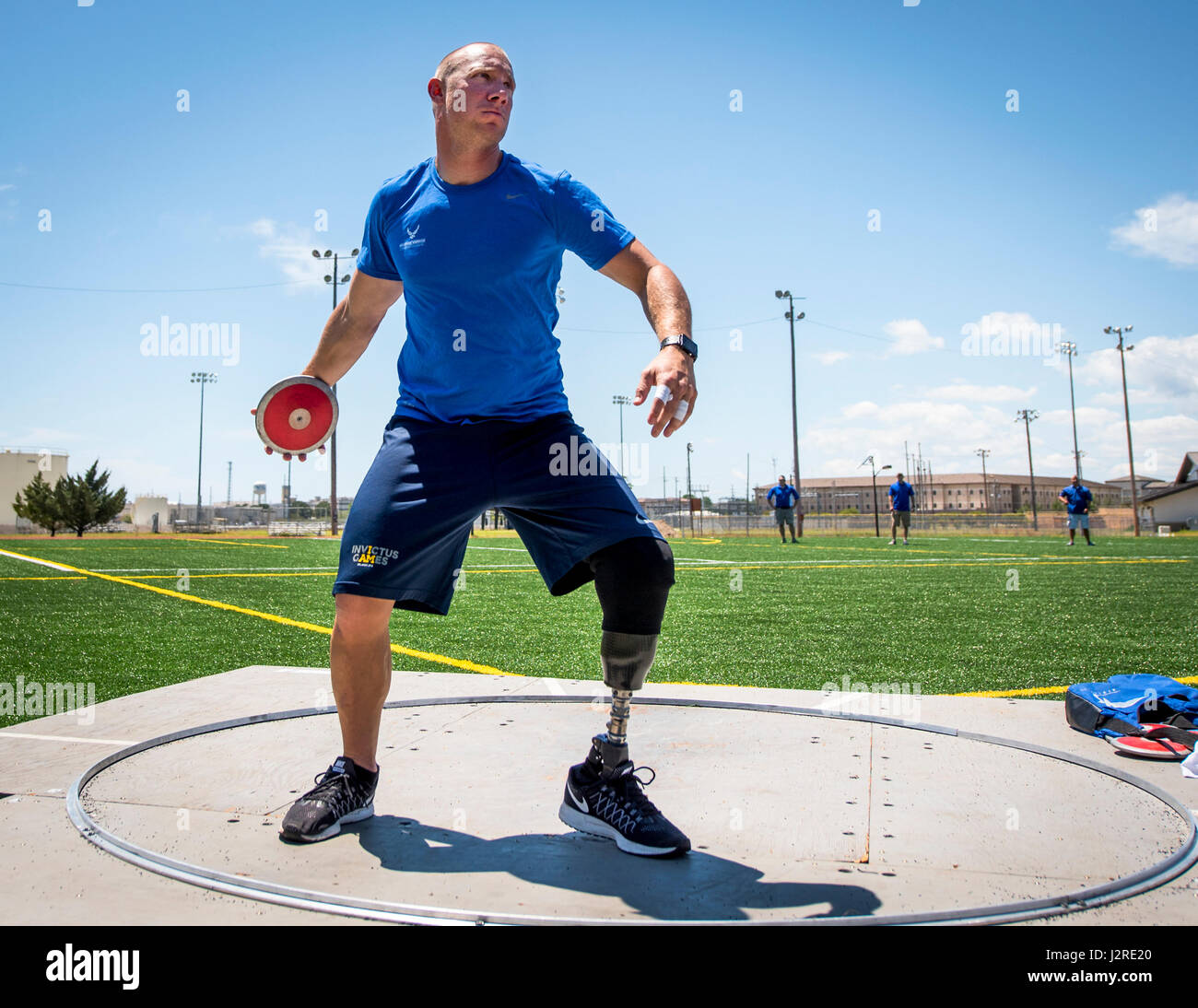 Ben Seekell, a Warrior Games athlete, begins his discus rotation during ...