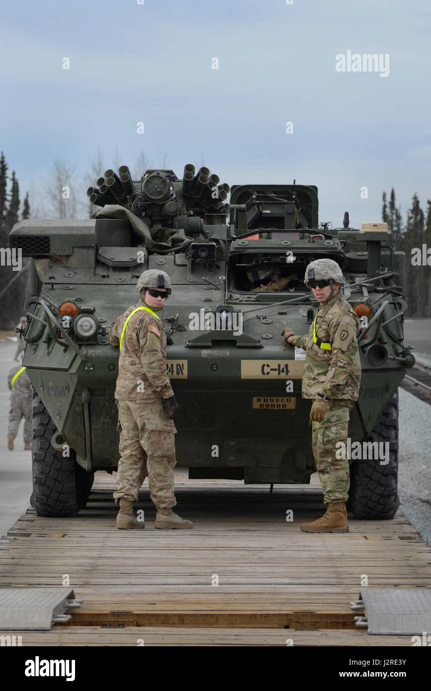 1st Stryker Brigade Combat Team soldiers unload M1126 Stryker Infantry ...