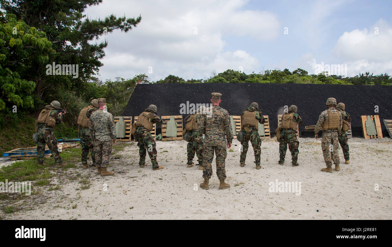 U.S. Marines with Headquarters Battalion, 3d Marine Division, engage ...