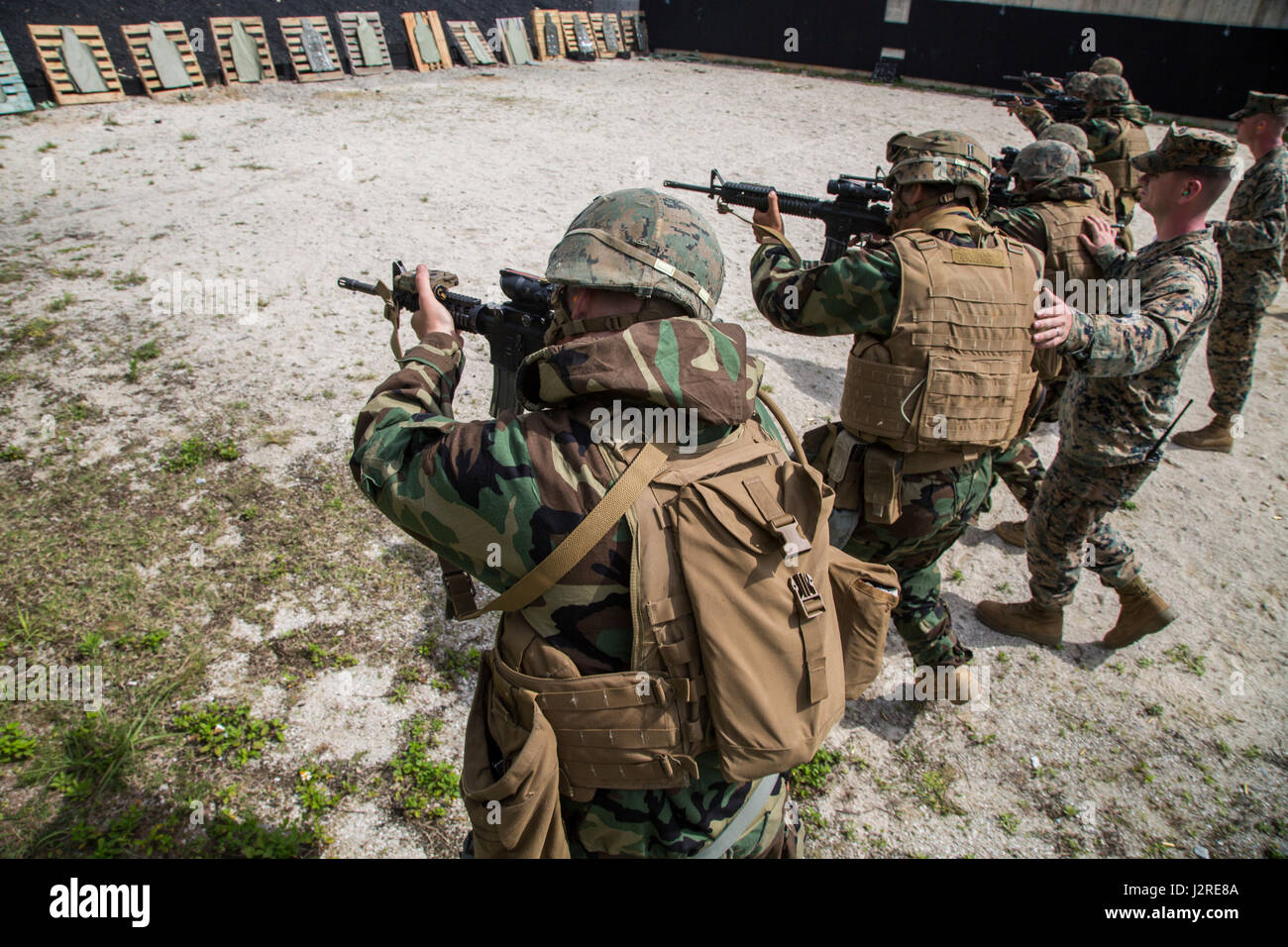 U.S. Marines with Headquarters Battalion, 3d Marine Division, engage ...