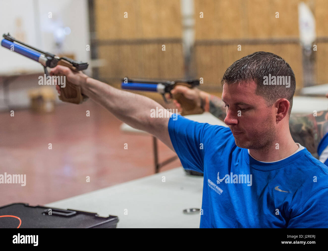 A Warrior CARE athlete, Corey Stanley aims his air pistol during a ...