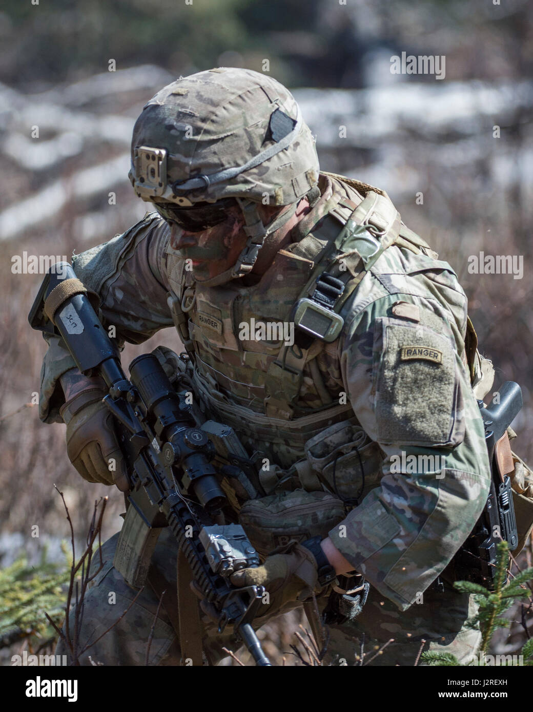 A paratrooper assigned to Scout Platoon, Headquarters and Headquarters ...