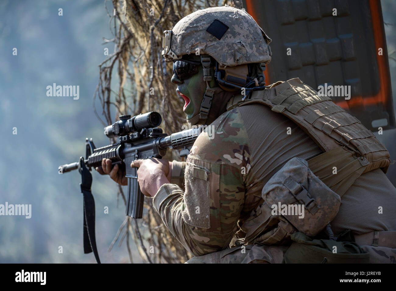 A paratrooper assigned to Scout Platoon, Headquarters and Headquarters ...