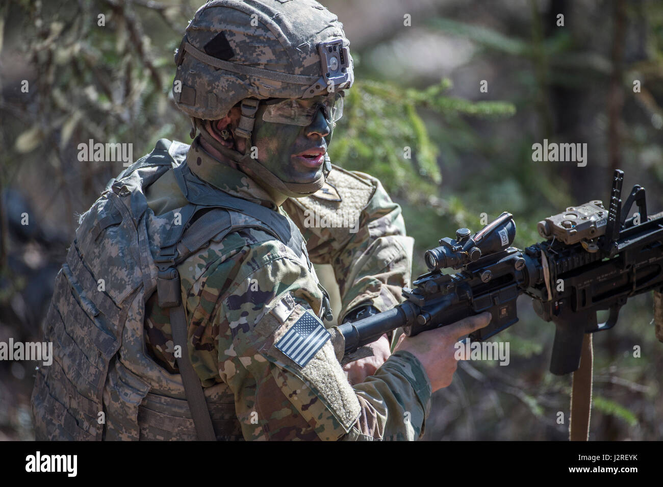 A paratrooper assigned to Scout Platoon, Headquarters and Headquarters ...