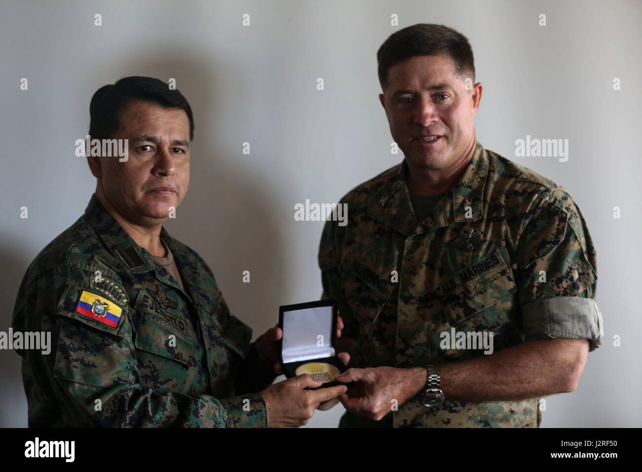 Colonel Ronier Ramirez, Ecuador (Left), presents Colonel Sean Killeen ...