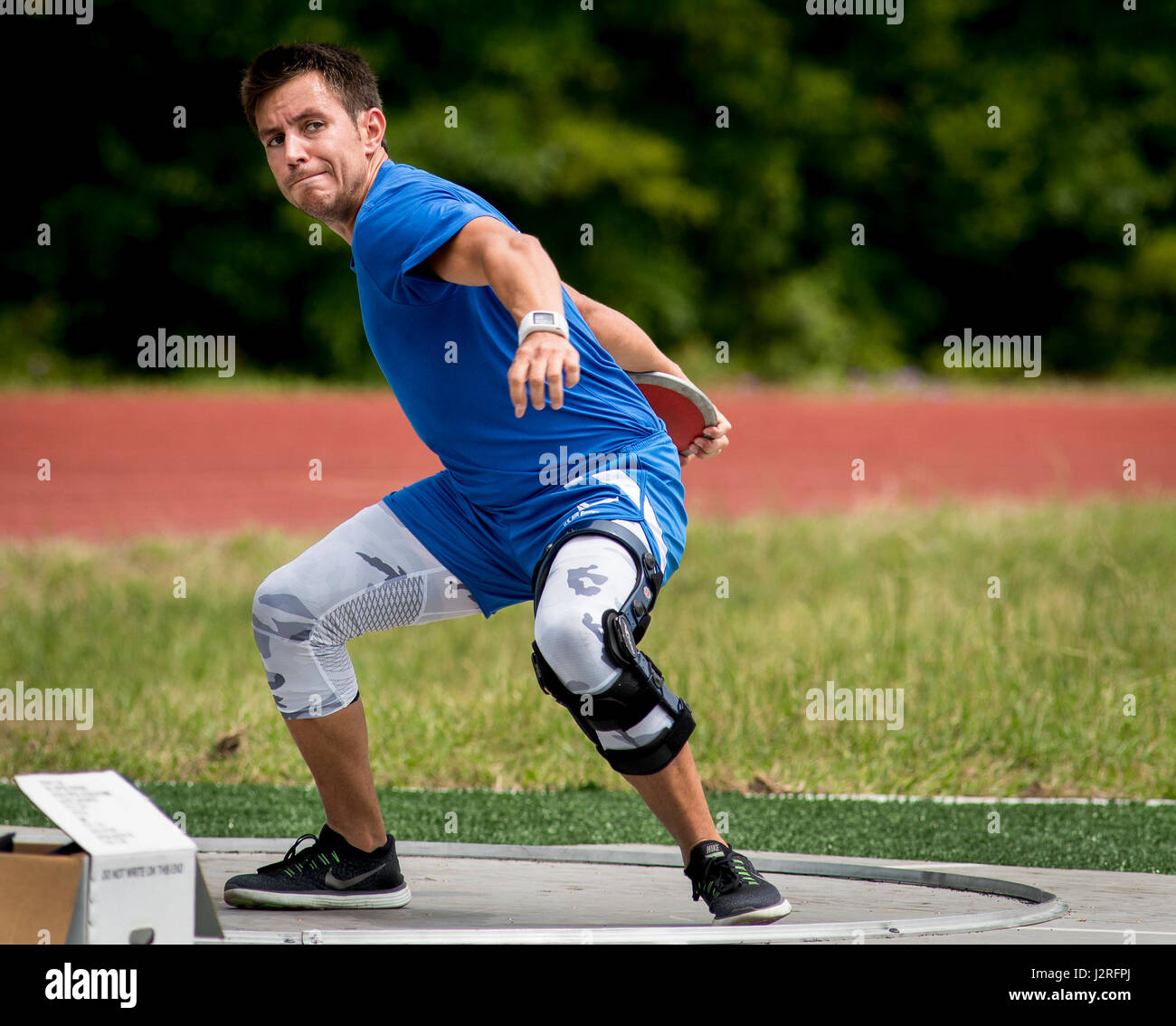 Master Sgt. Keith Guinn, a Warrior Games athlete, begins his discus ...