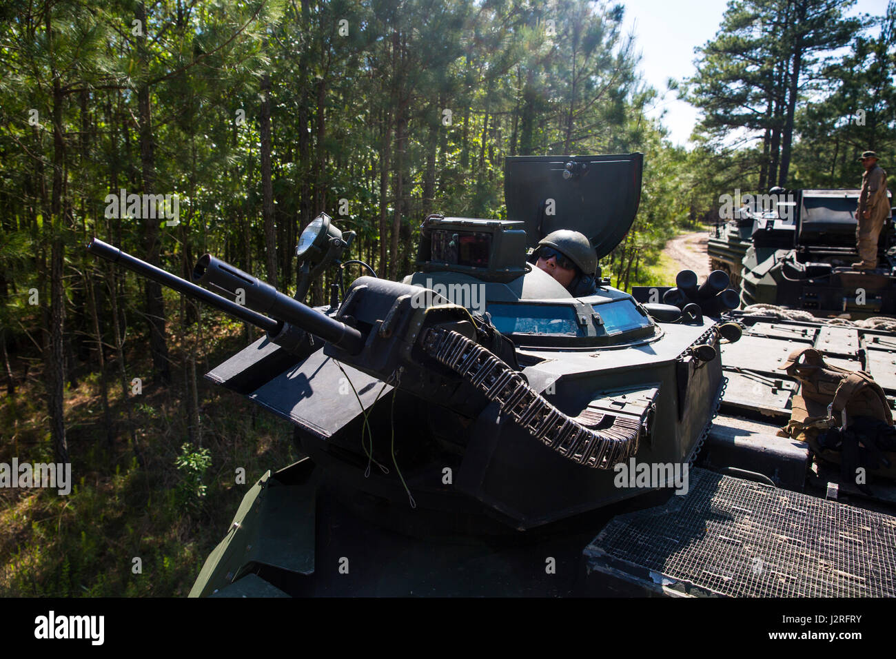 A Marine tests the turret orientation on an Amphibious Assault Vehicle ...