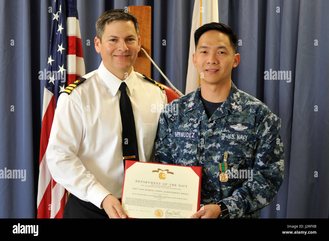 A Navy Hospital Corpsman 1st Class assigned to NAF Misawa receives the ...