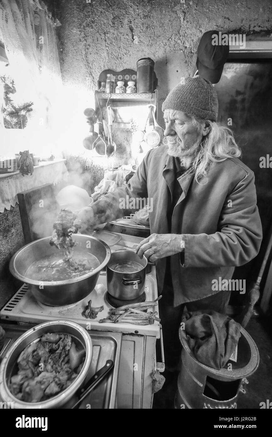 Man cooking meat on Black and White Stock Photos & Images - Alamy