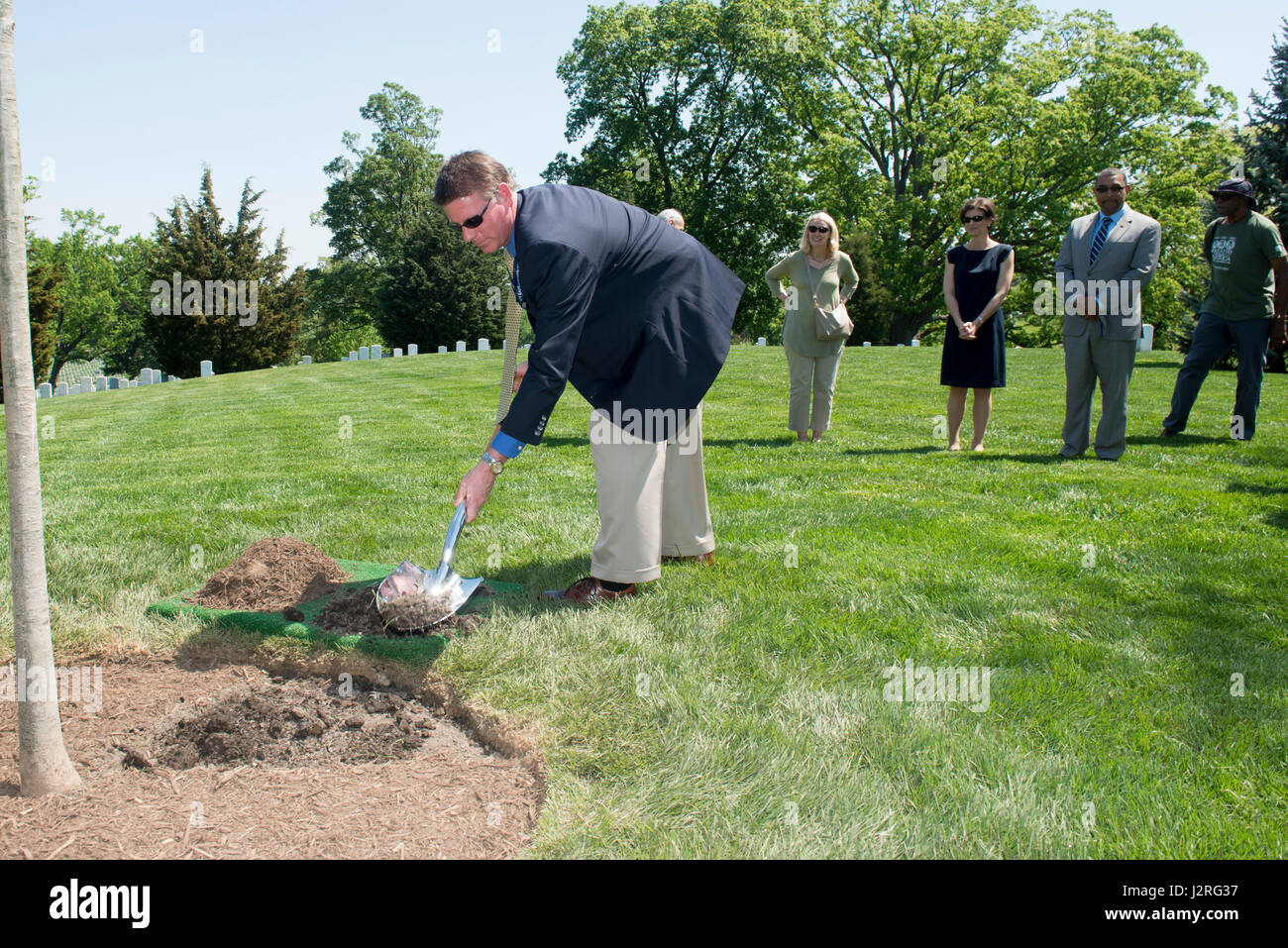Members of the horticulture department conduct a tree planting ceremony ...