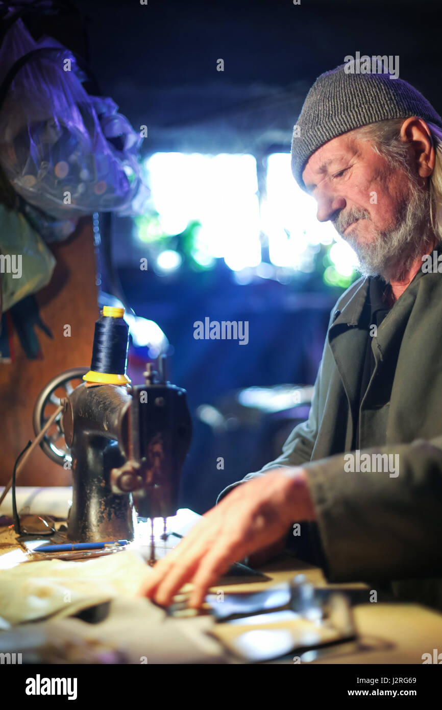 Man sewing hi-res stock photography and images - Alamy