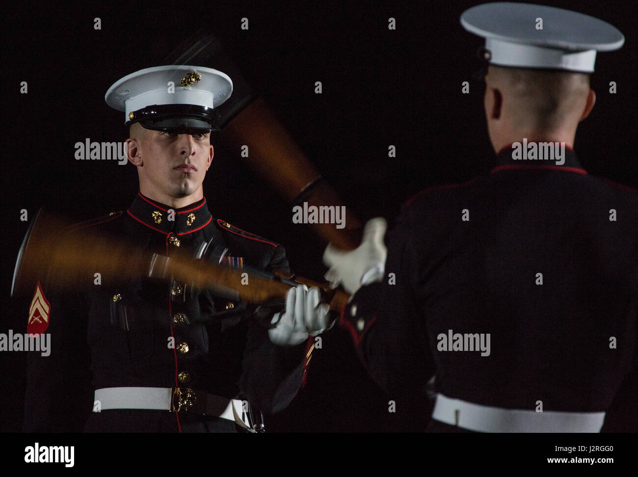 U.S. Marines with the Silent Drill Platoon perform during an evening ...