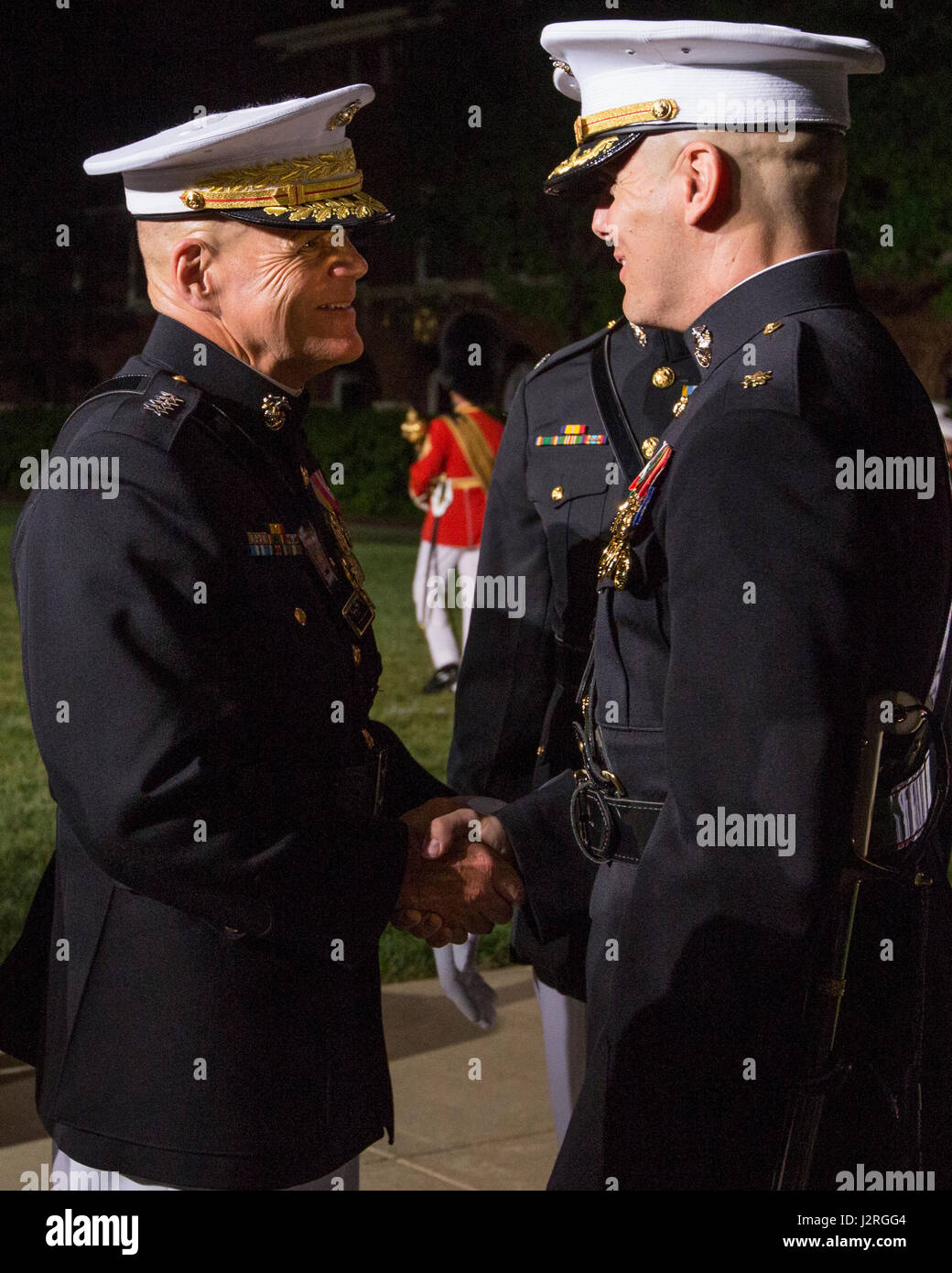Commandant of the Marine Corps Gen. Robert B. Neller, left, shakes ...