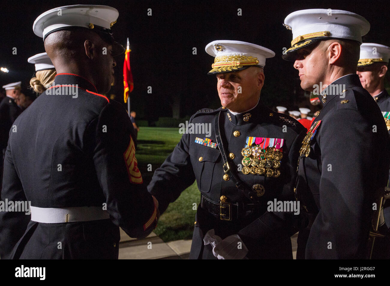 Commandant of the Marine Corps Gen. Robert B. Neller, center, shakes ...