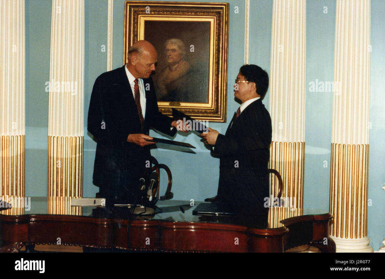 men exchanging papers Stock Photo - Alamy