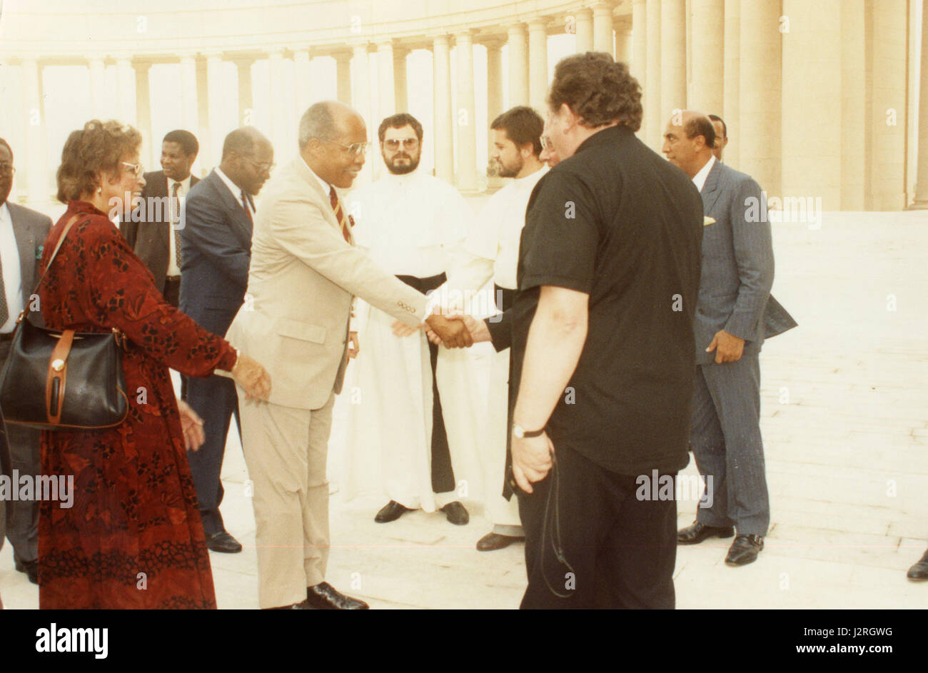 A GROUP OF MEN AND WOMAN GREETING EACH OTHER Stock Photo - Alamy