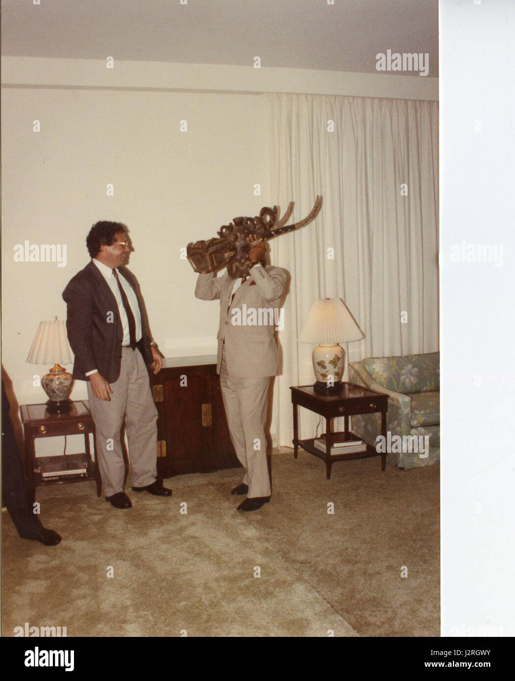 TWO MEN ARE IN A ROOM HAVING A CONVERSATION Stock Photo - Alamy