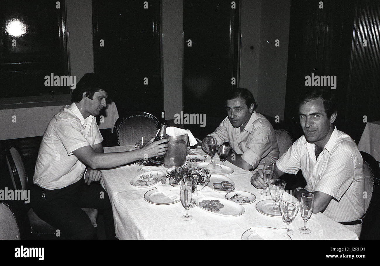 MEN SITTING AT A DINING TABLE Stock Photo - Alamy