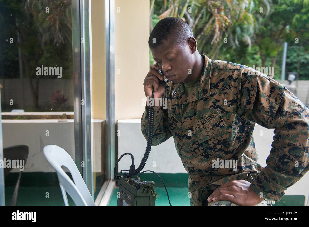U.S. Marine Staff Sgt. Alexander Davis makes a test call on a AN/PRC ...