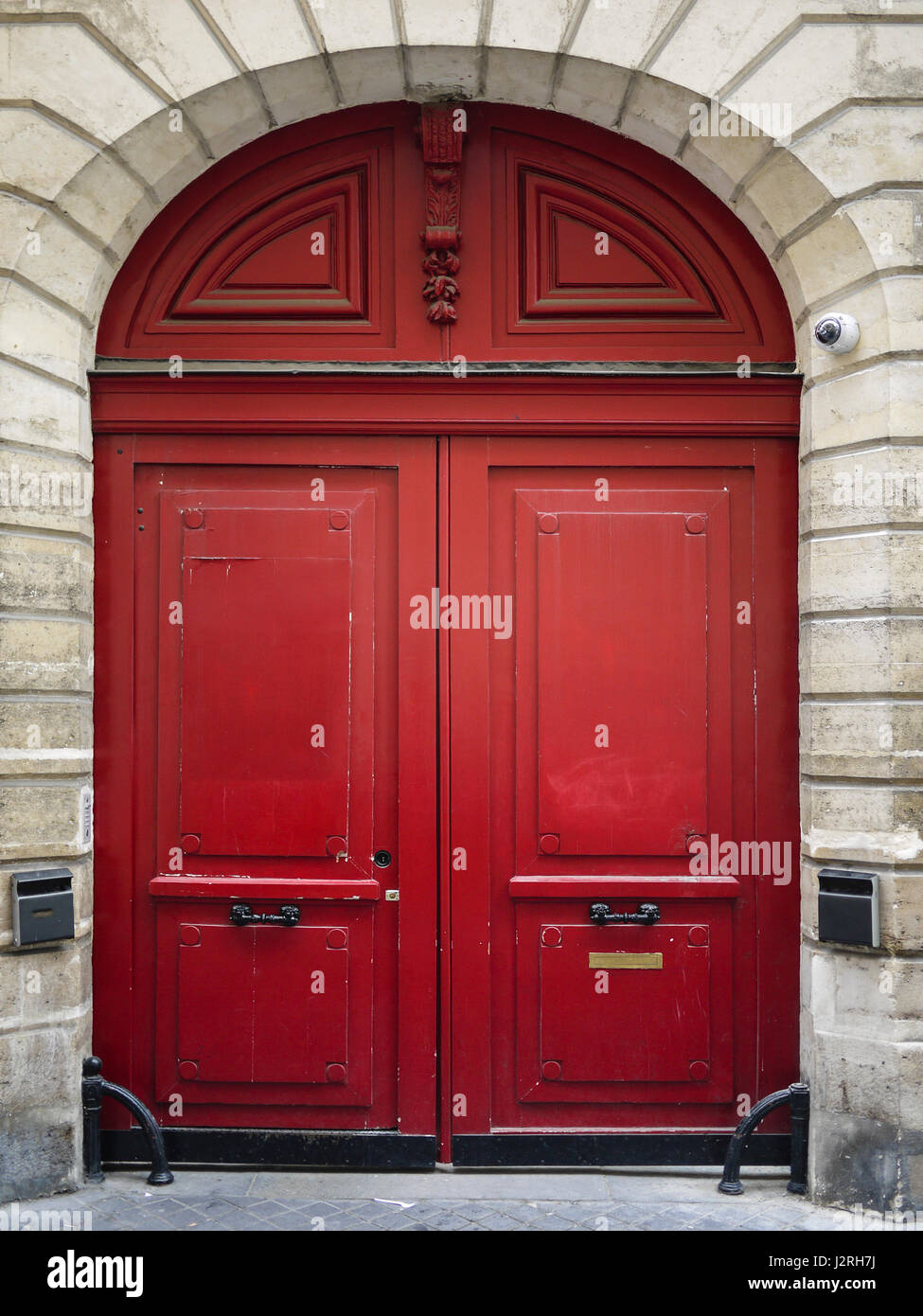 Vintage red wooden doors in Paris France Stock Photo - Alamy
