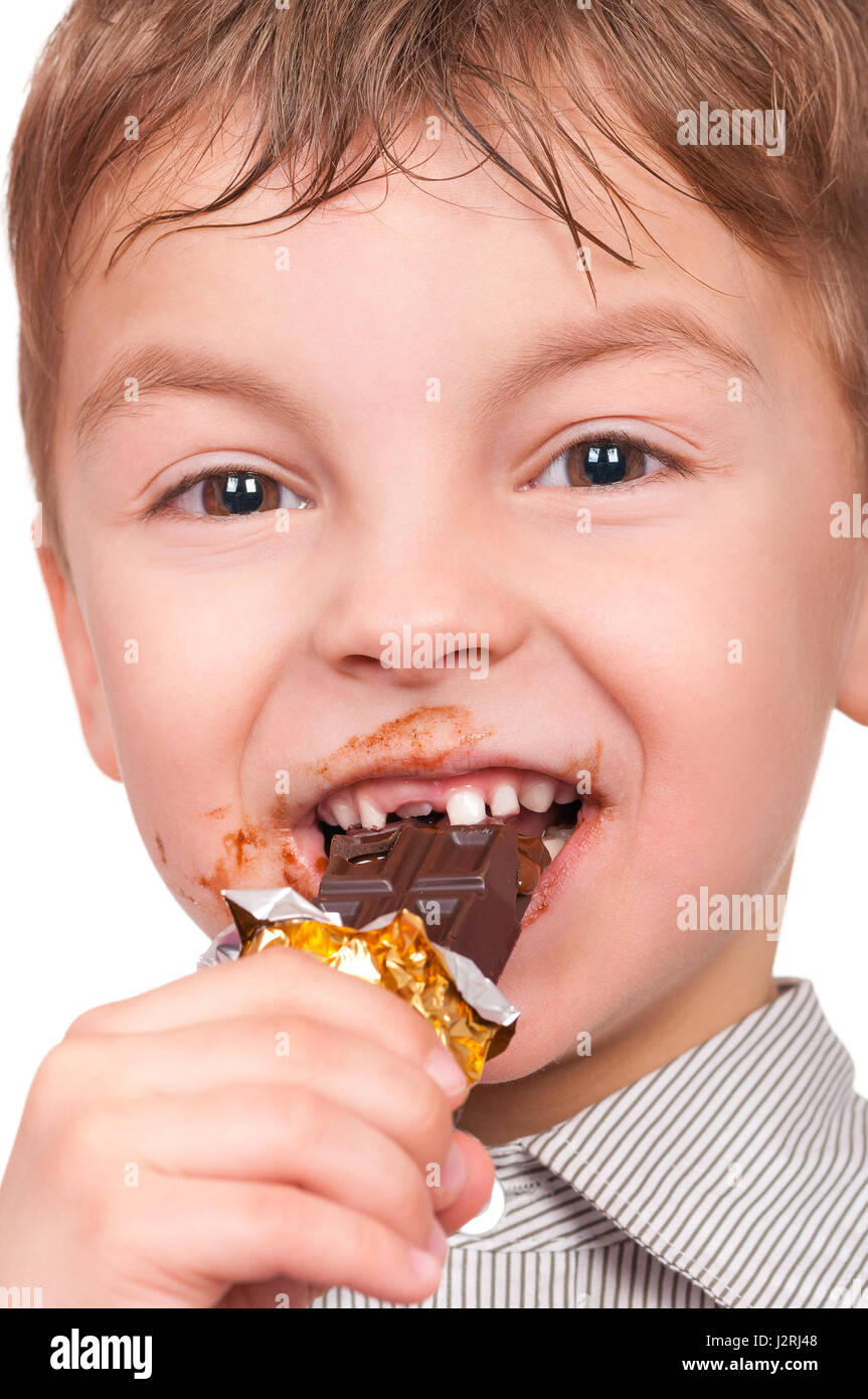 Little boy eating chocolate Stock Photo - Alamy