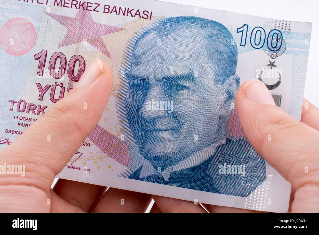 Hand holding 100 Turksh Lira banknotes on white background Stock Photo ...