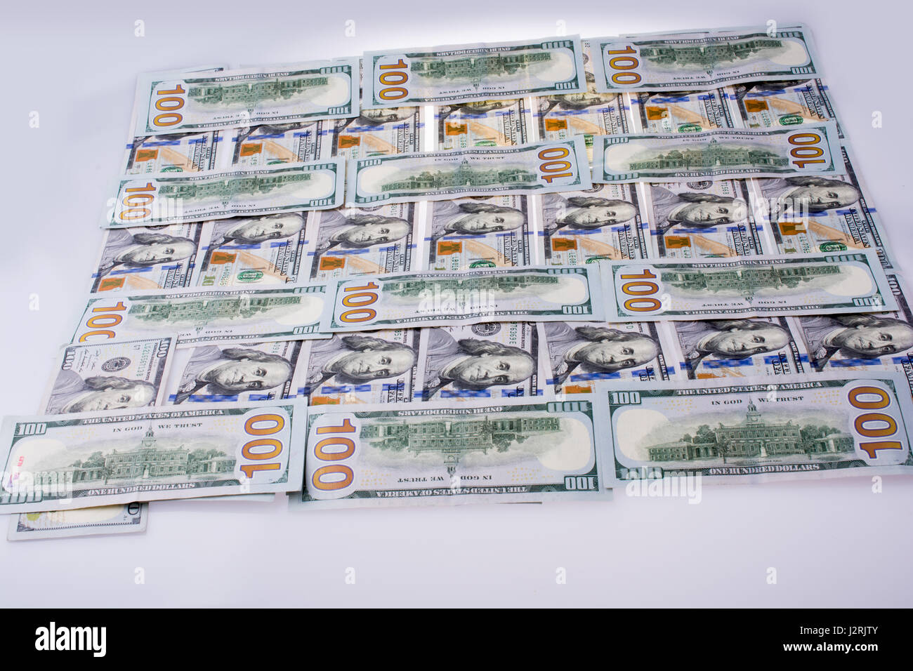 American 100 dollar banknotes made of paper placed on white background ...