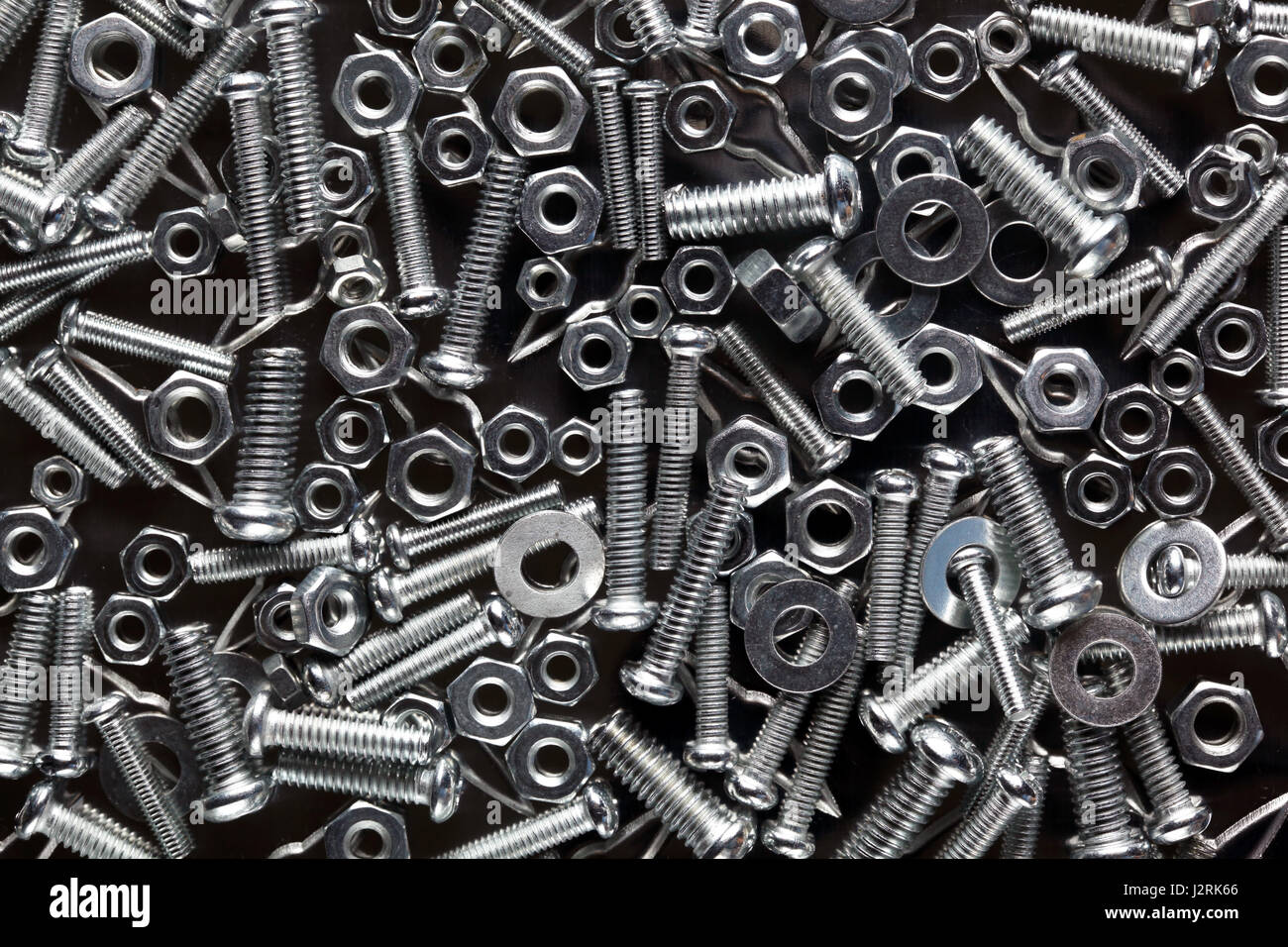 Nuts and bolts background Stock Photo - Alamy