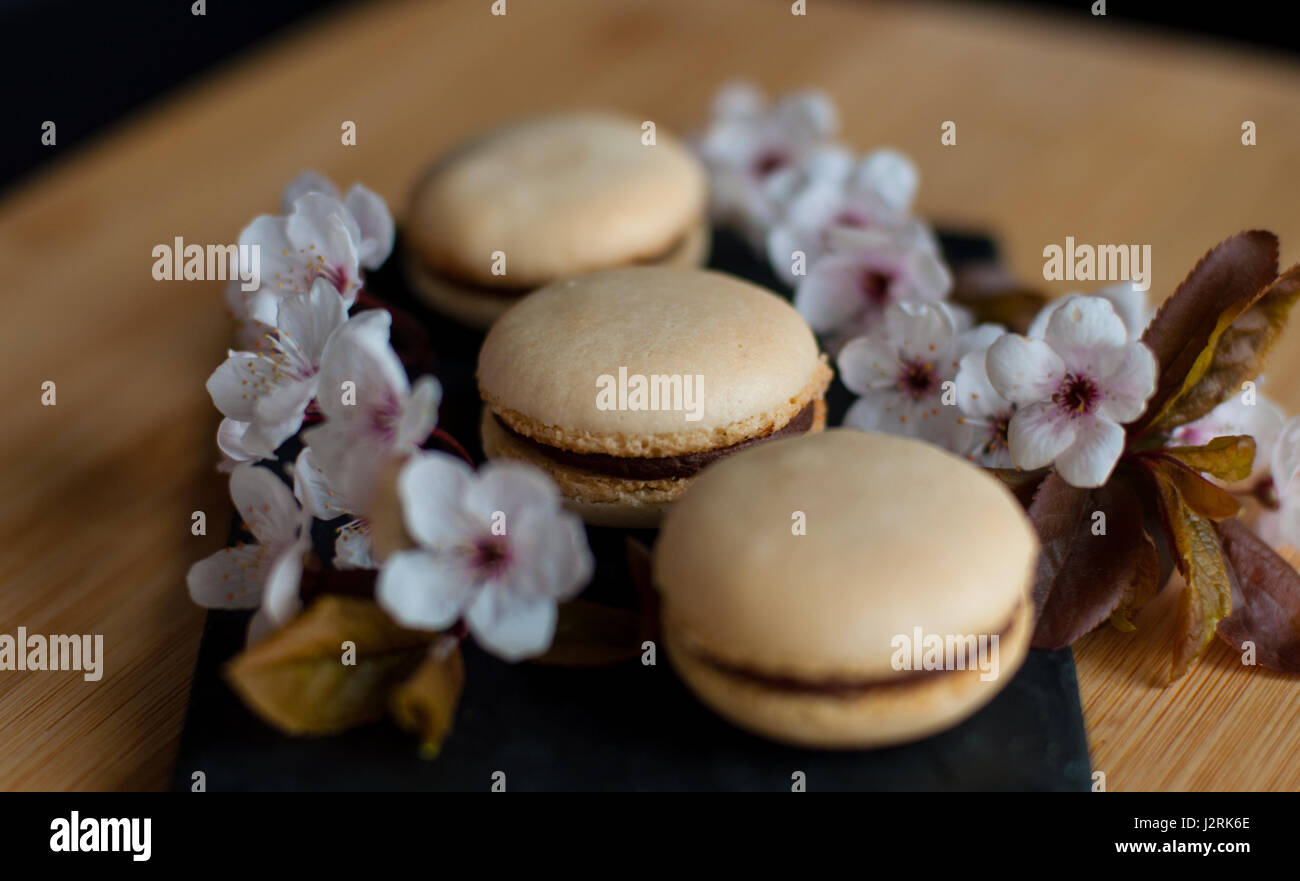 Macaroons decorated with flowers Stock Photo - Alamy