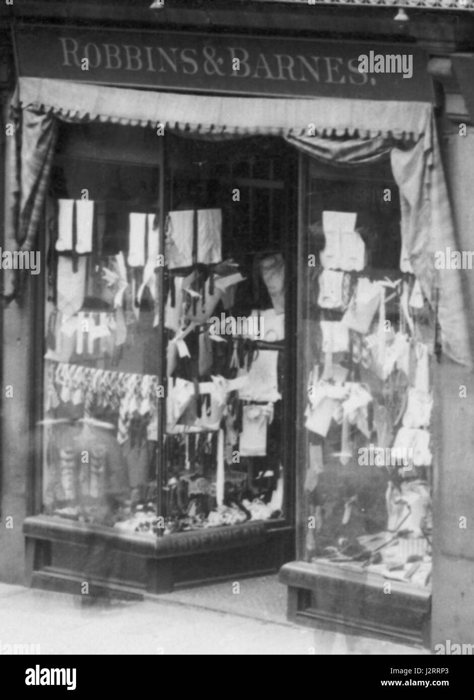 This photograph from 1903 captures the Robbins Barnes building located ...