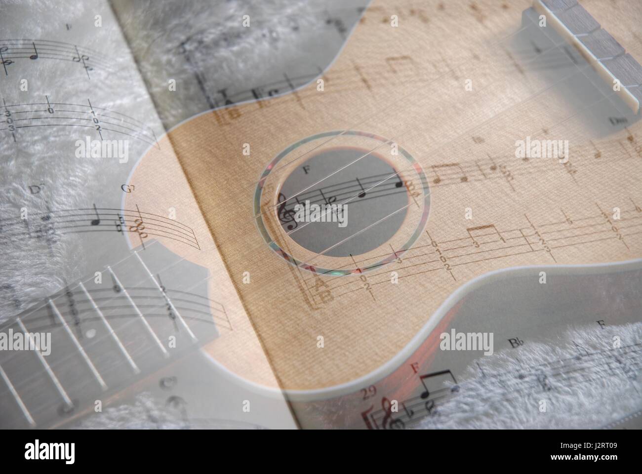 Ukulele and music, in tab and notation. Double exposure Stock Photo - Alamy
