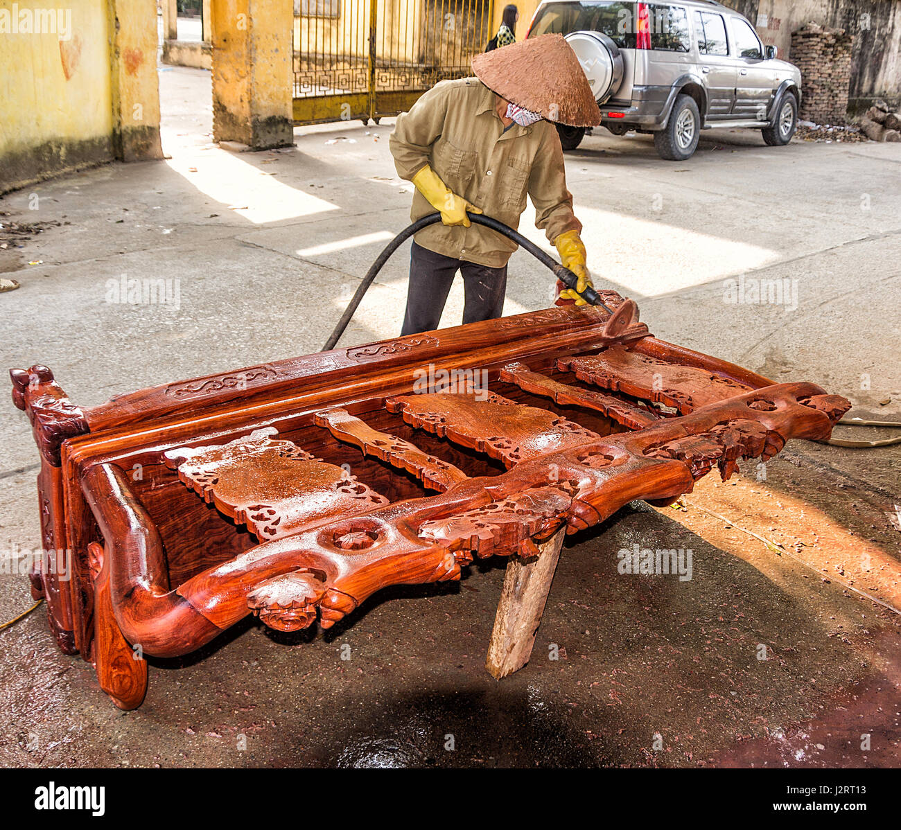 Craftsman sanding a handmade chair in Vietnam Stock Photo - Alamy
