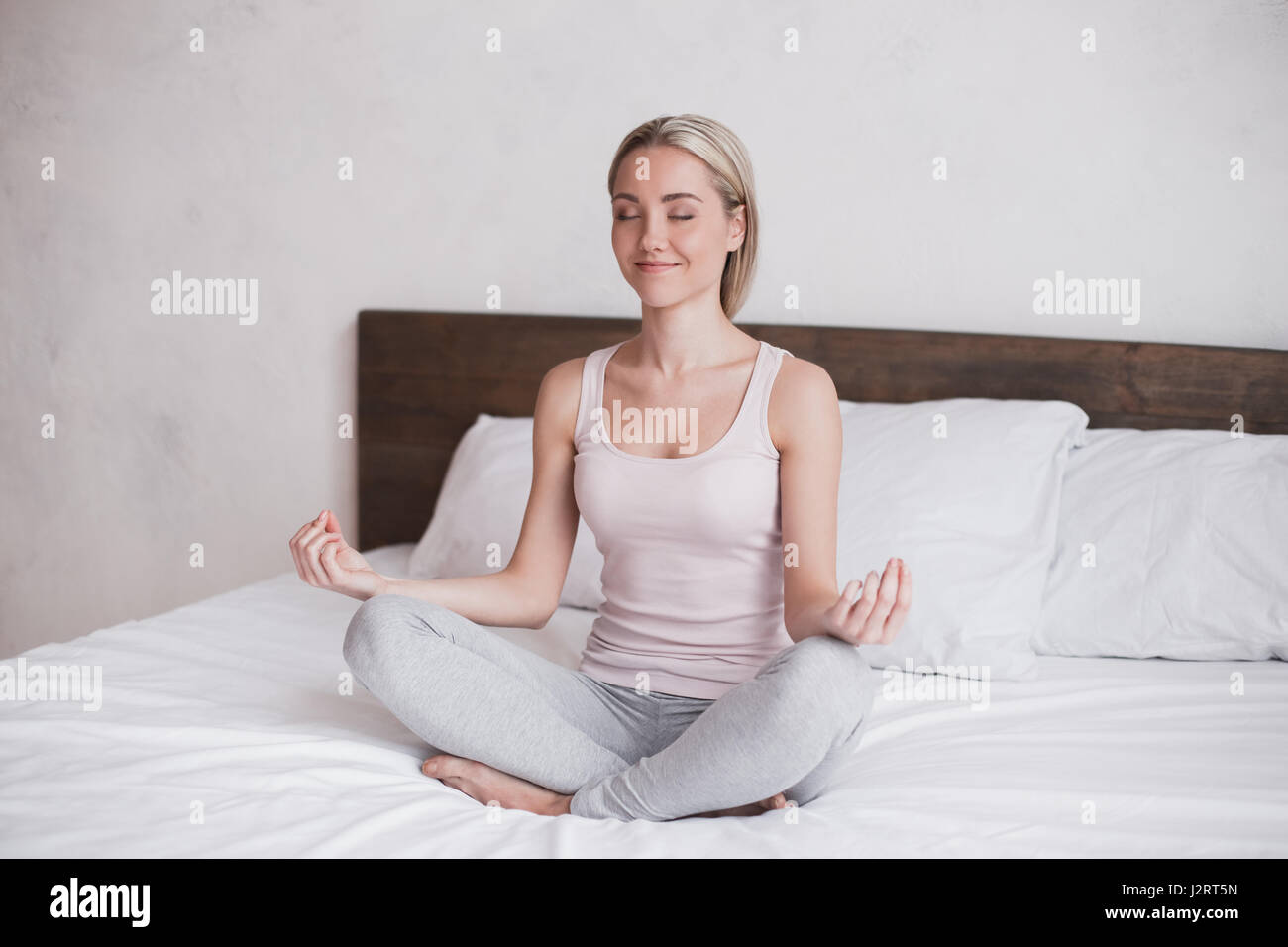 Meditating woman yoga practice lotus hi-res stock photography and ...
