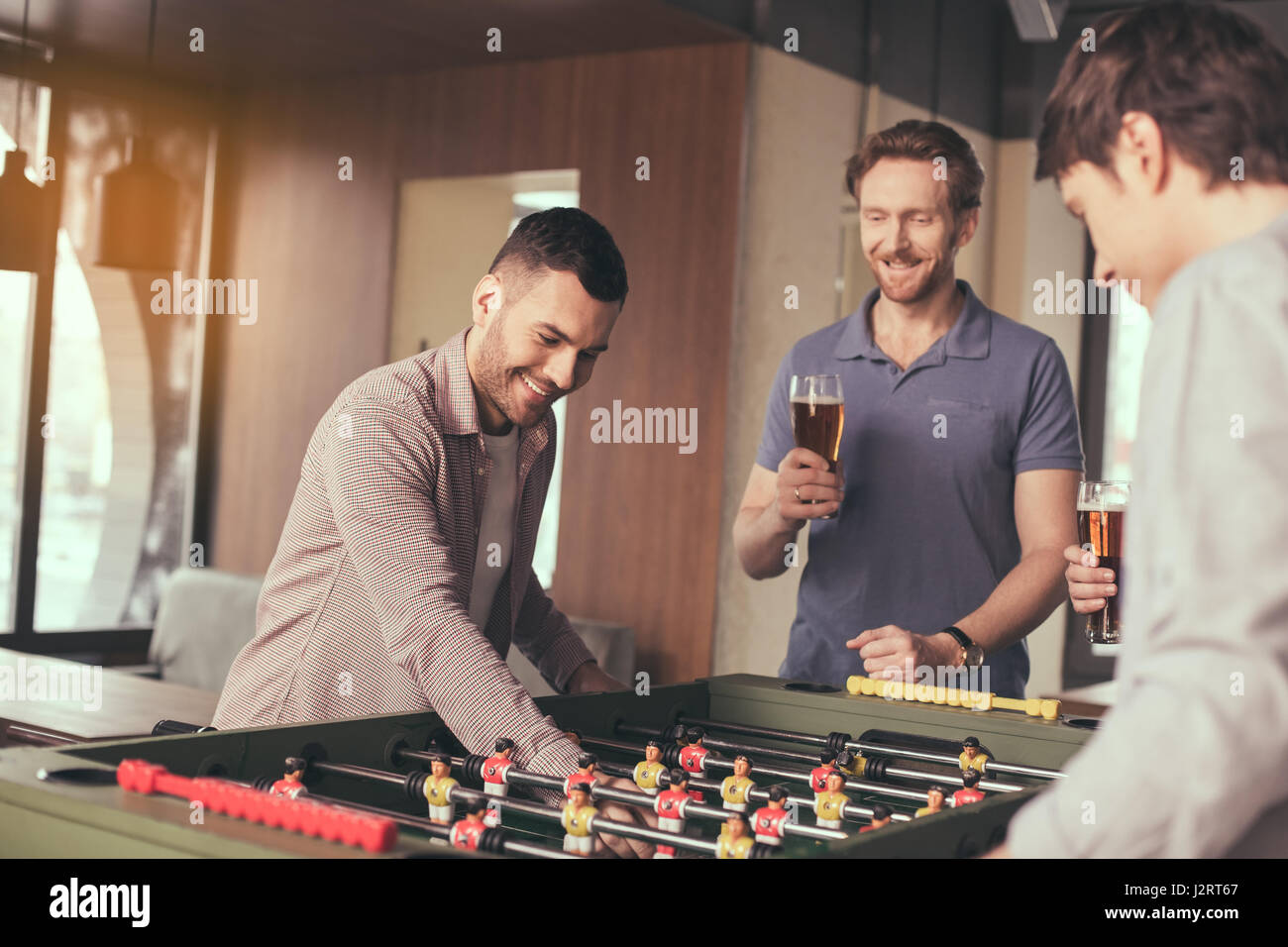 Friends having fun in pub Stock Photo - Alamy