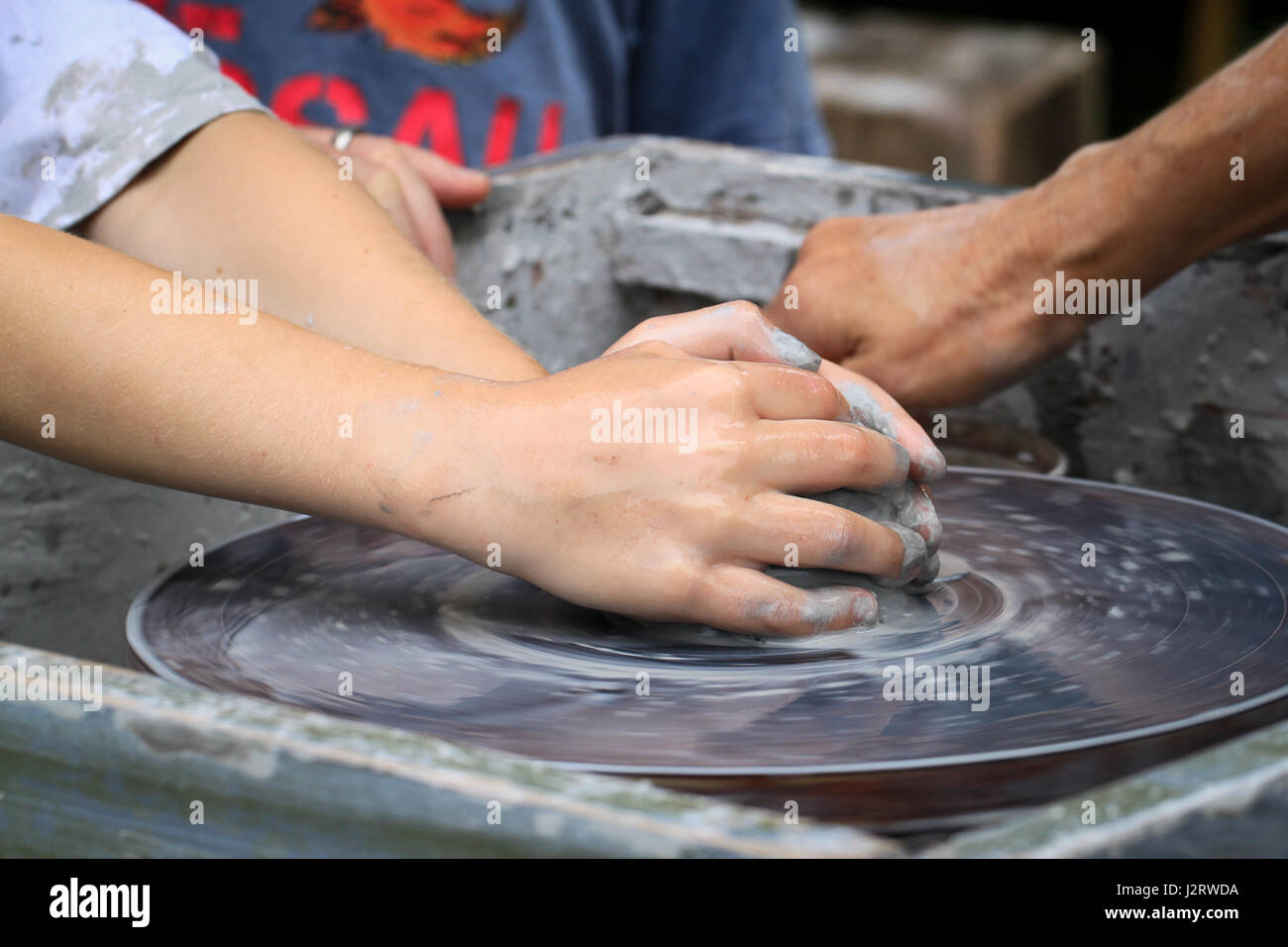 Pottery making, teaching pottery. A lump of wet clay begins to take ...