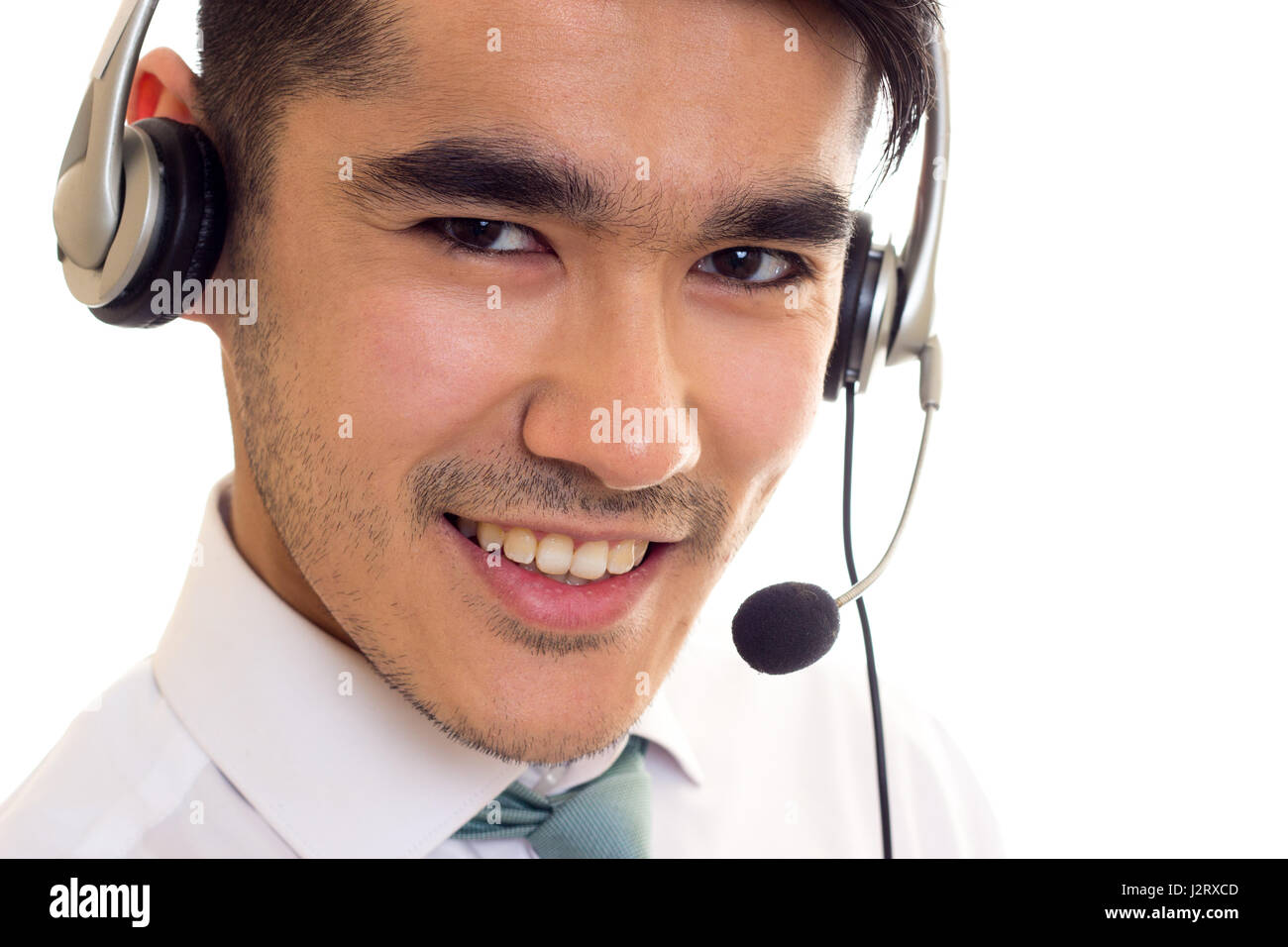 Young man using headphones Stock Photo - Alamy