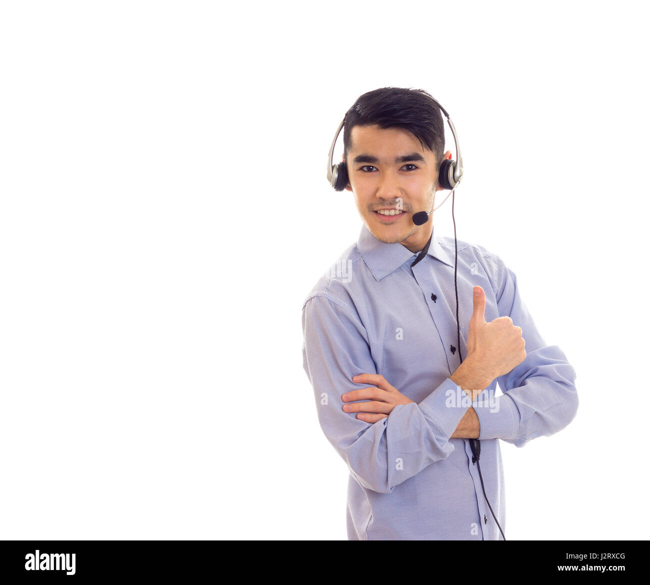 Young man using headphones Stock Photo - Alamy