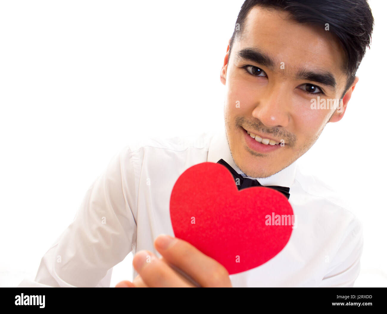 Young man holding a read heart Stock Photo - Alamy