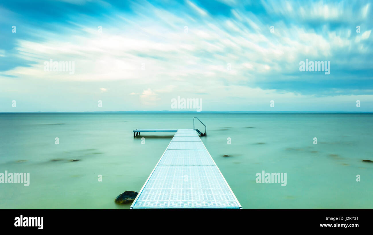 Pier in ocean Stock Photo - Alamy