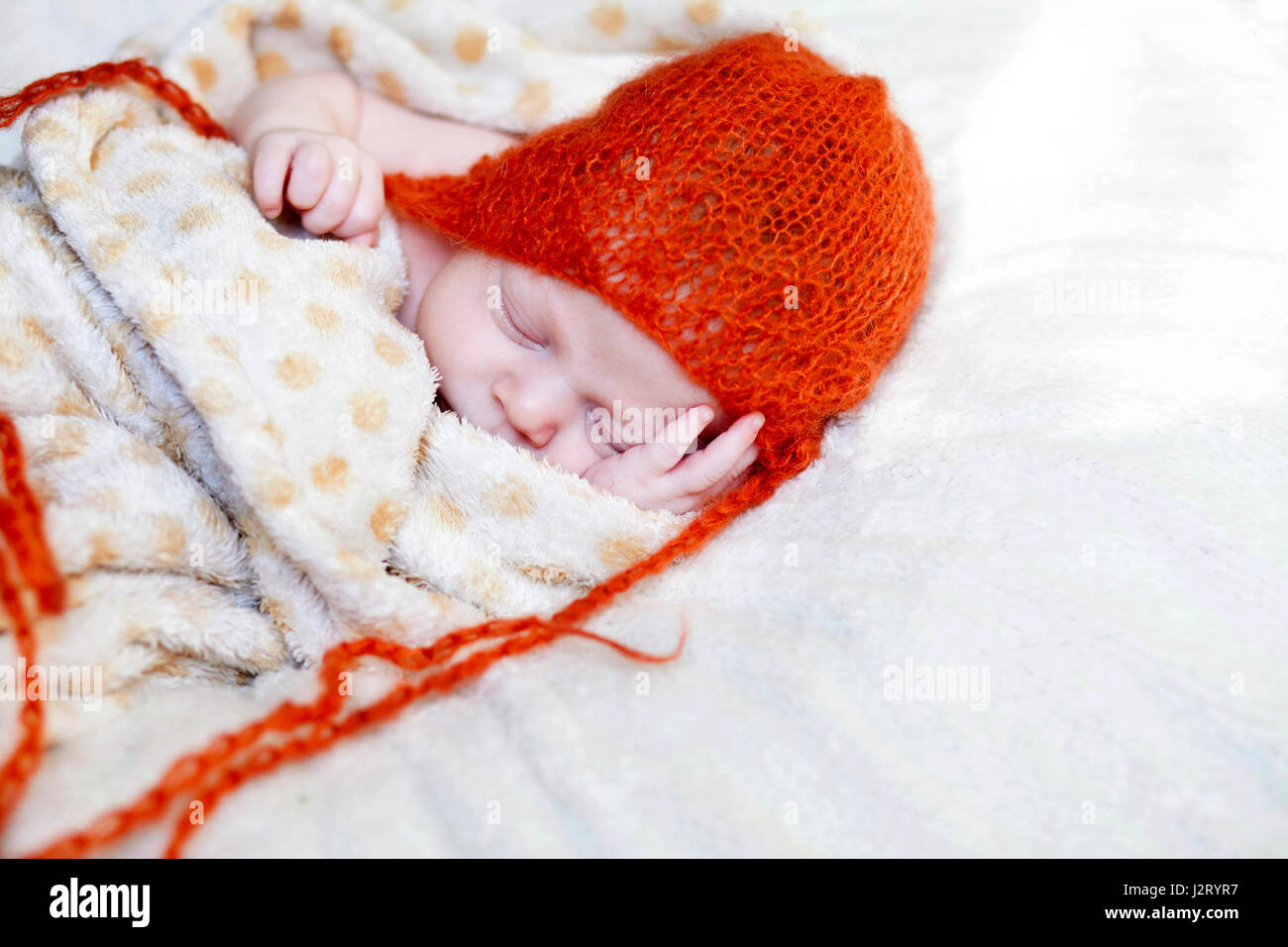 Cute baby fast asleep resting its cheek on its palm Stock Photo - Alamy