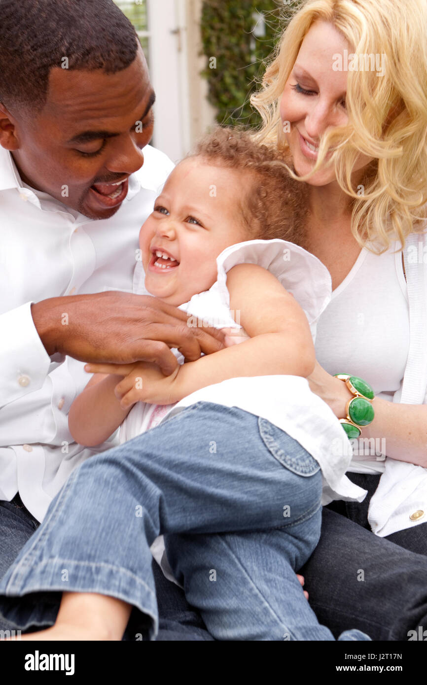 Portrait of happy multicultural family smiling Stock Photo - Alamy