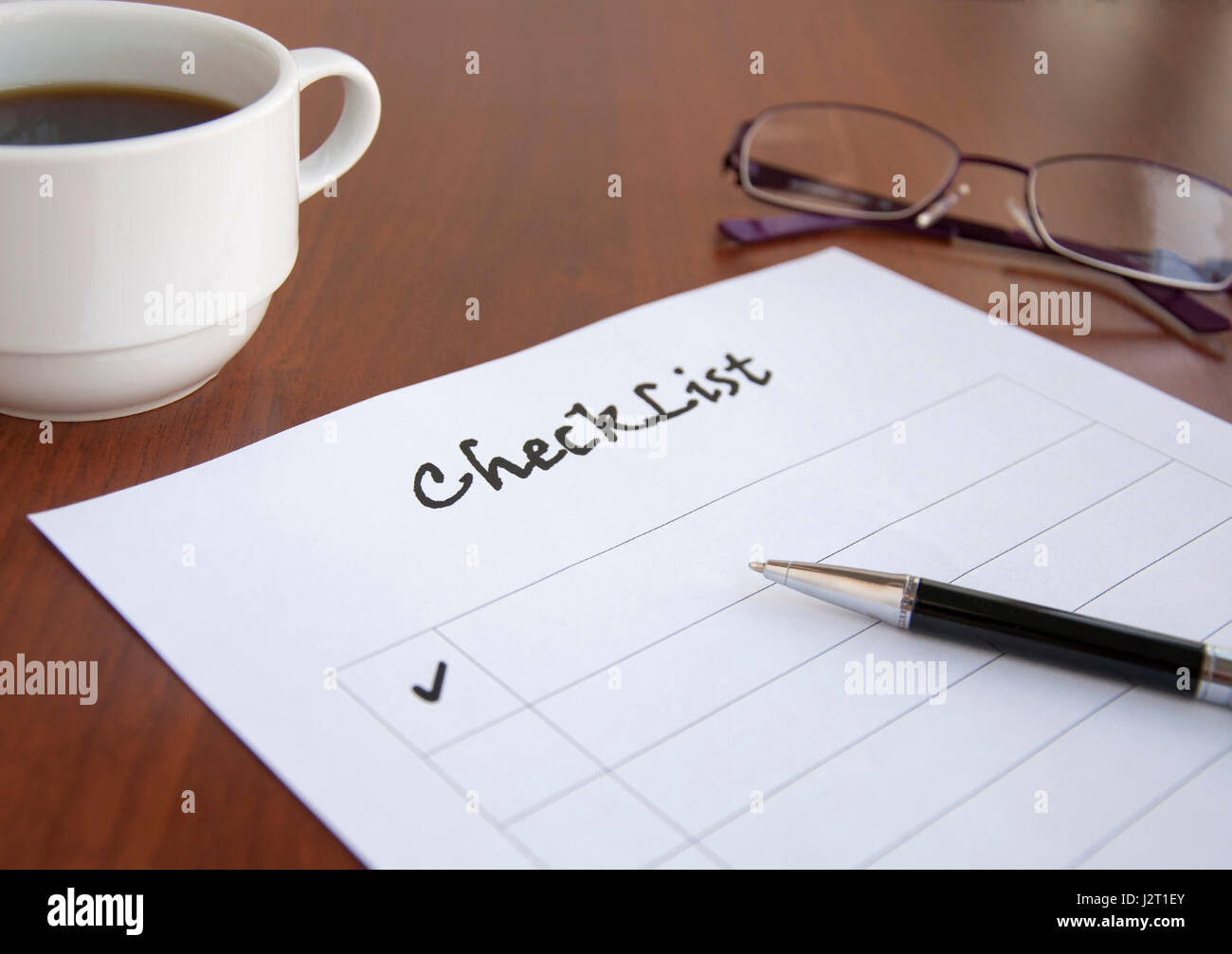 blank checklist on wooden table With coffee and glasses Stock Photo - Alamy