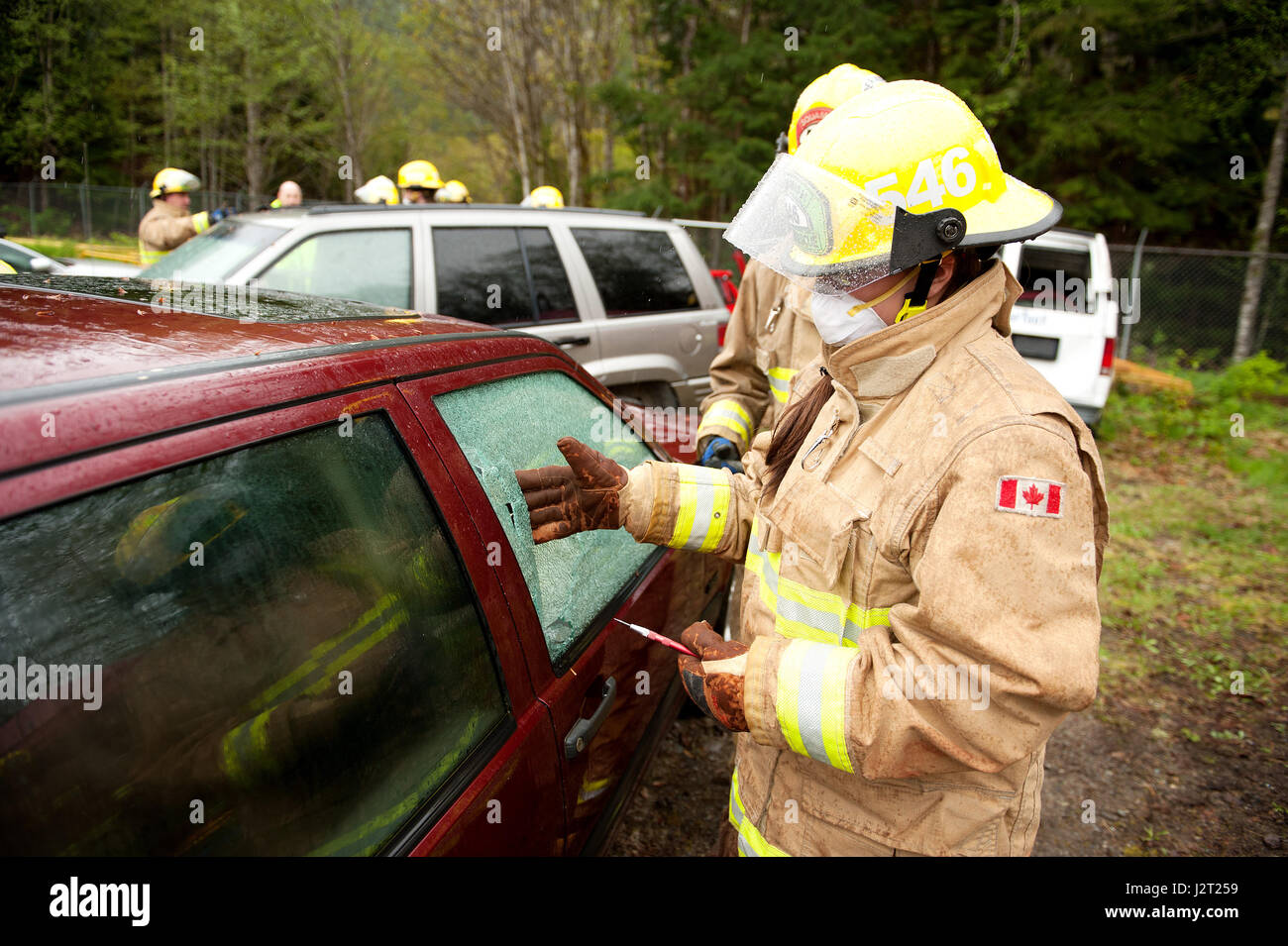 Trainee fire fighter and Howe Sound Secondary student Kei Gray works on ...